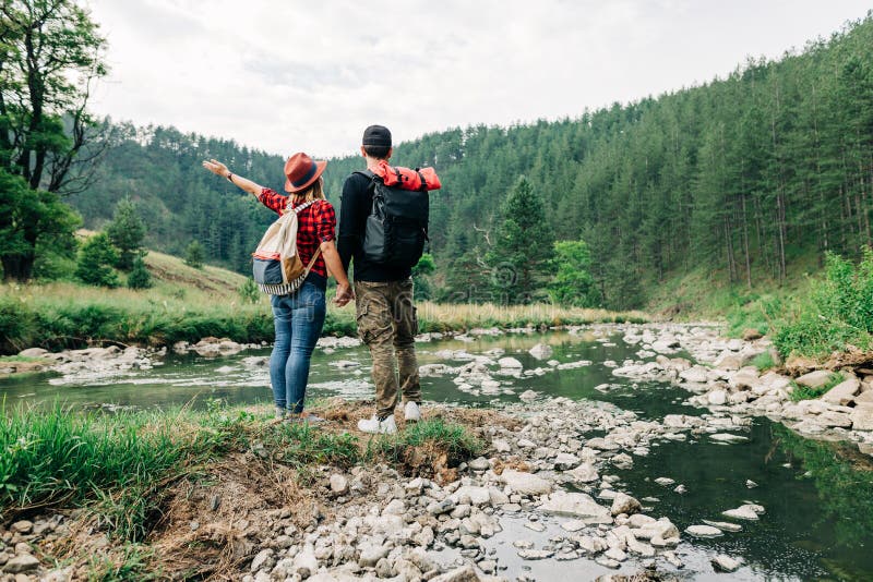 Couple Exploring Nature by the Mountain River Stock Image - Image of ...