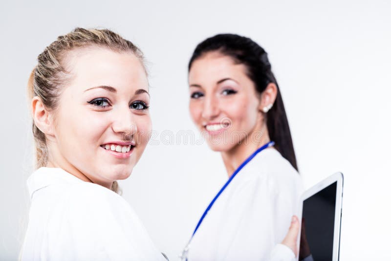 Couple of Female Doctors with Tablet Stock Image - Image of smiling ...