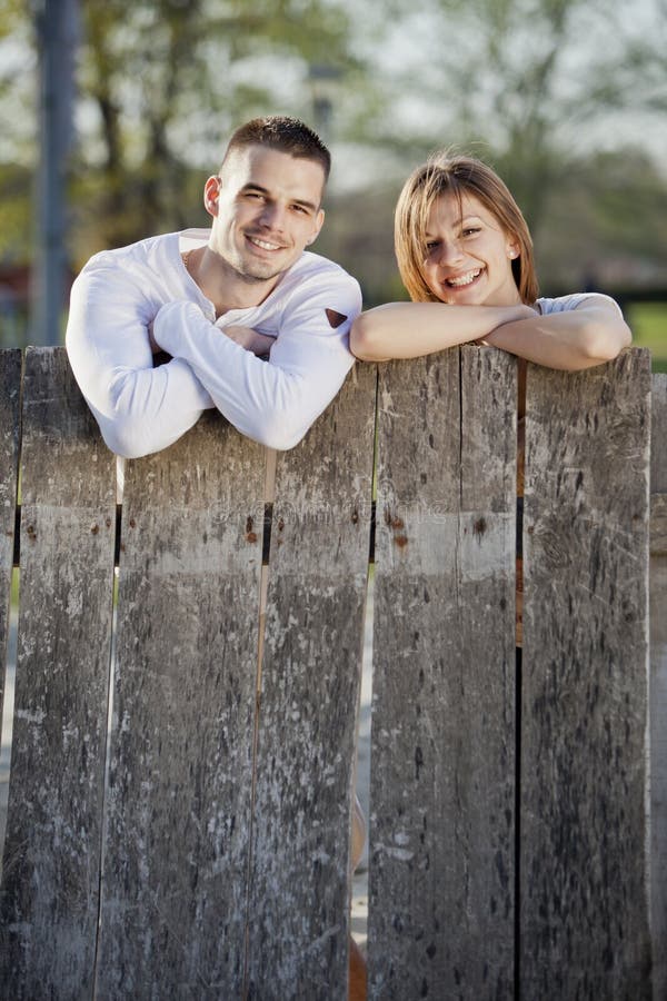 Couple on the Fence stock image. Image of family, date - 122913