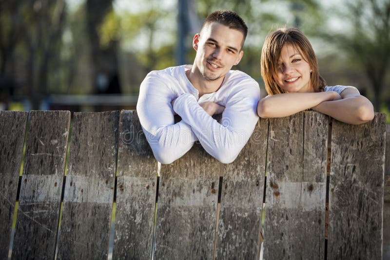 Couple on the Fence stock image. Image of family, date - 122913