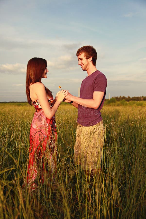 Couple in Field stock image. Image of lady, teenagers - 18911833