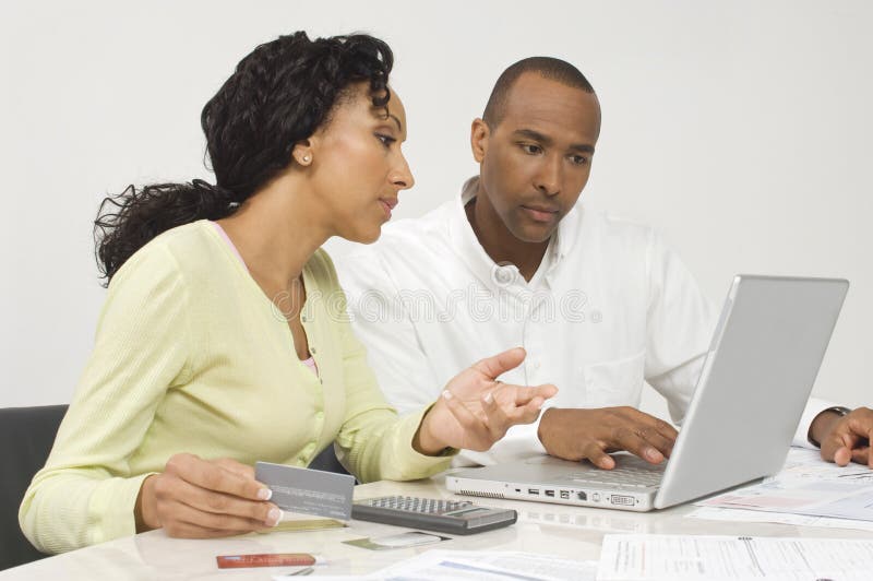 Young Black Couple Paying Bills Online with Laptop Computer Stock Photo ...