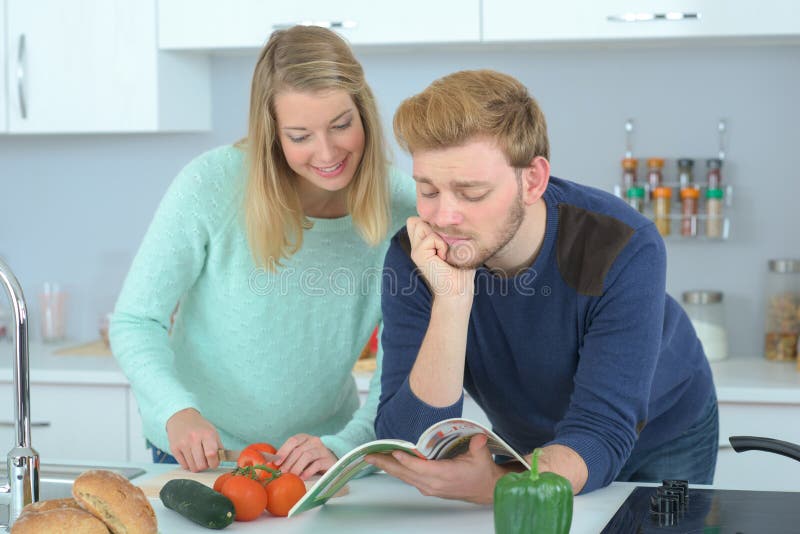 Man Following Recipe at Home in Kitchen Stock Image - Image of apron ...