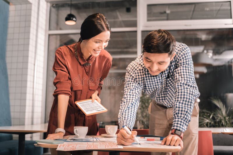 Couple of Freelancers Making Some Notes while Having Discussion Stock ...