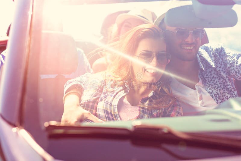 Couple with Friends Driving in the Sunset Stock Photo - Image of ...