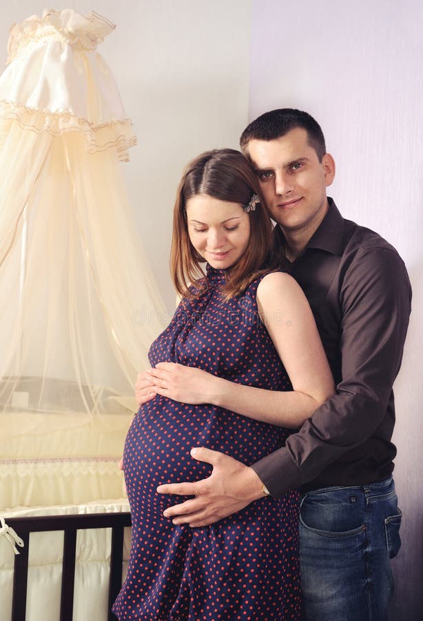 Couple Future Parents Near a Cot. Stock Photo - Image of anticipation ...