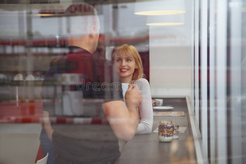 Couple at Gas Station Cafe stock image. Image of preserving - 72983987