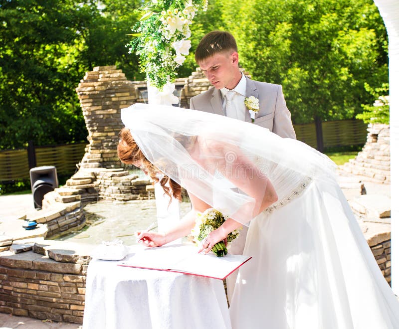 Couple Getting Married at an Outdoor Wedding Ceremony Stock Photo ...