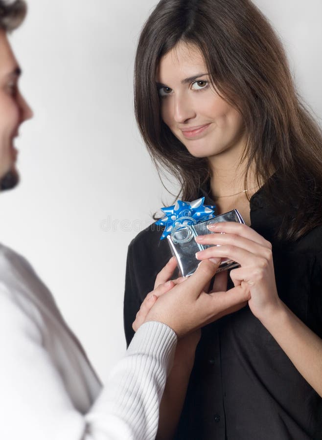 Couple with gift box stock photo. Image of vertical, young - 1657892