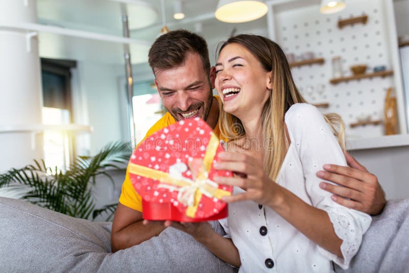Couple with Gift Box Hugging at Home Stock Image - Image of indoor ...