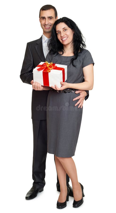 Couple with Gift Box, Studio Portrait on White. Dressed in Black Suit ...