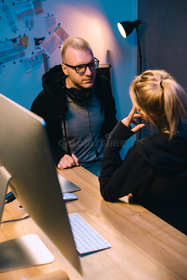 Couple of Hackers Talking To Each Other at Workplace Stock Photo ...