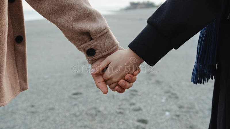 Couple Hand by Hand Walk Together on the Beach in Valentines Day Stock ...