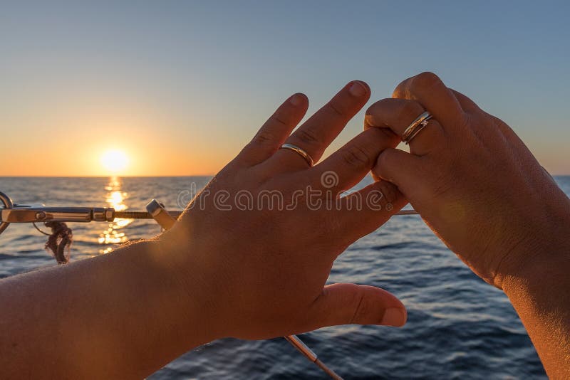 Couple Hands with Rings, Hands with Wedding Rings, Overlooking T Stock ...