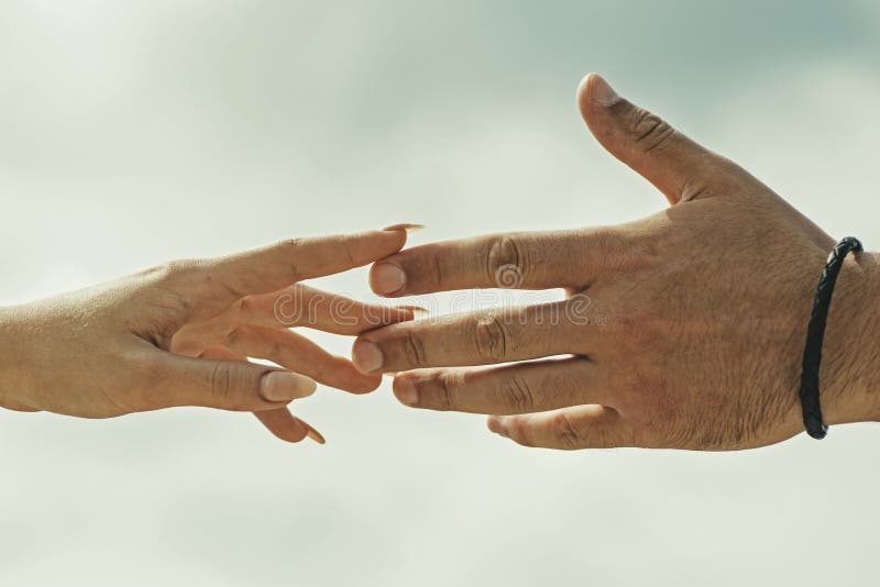 Couple Hands. Helping Hand. Holding Hand, Close Up. Giving a Help Hand ... Couple Hands. Helping Hand. Holding Hand, Close Up. Giving a Help Hand ...