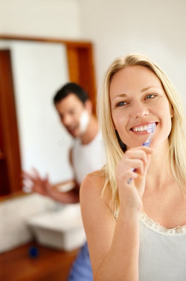 Couple Happy And Brushing Teeth In Bathroom In Morning For Love