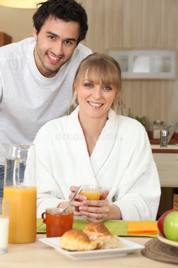 A couple having breakfast stock image. Image of bathrobe - 26933703