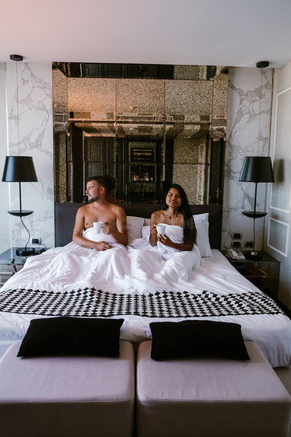 Couple Having Breakfast in Bed, Men and Woman in Luxury Room and White ... Couple Having Breakfast in Bed, Men and Woman in Luxury Room and White ...