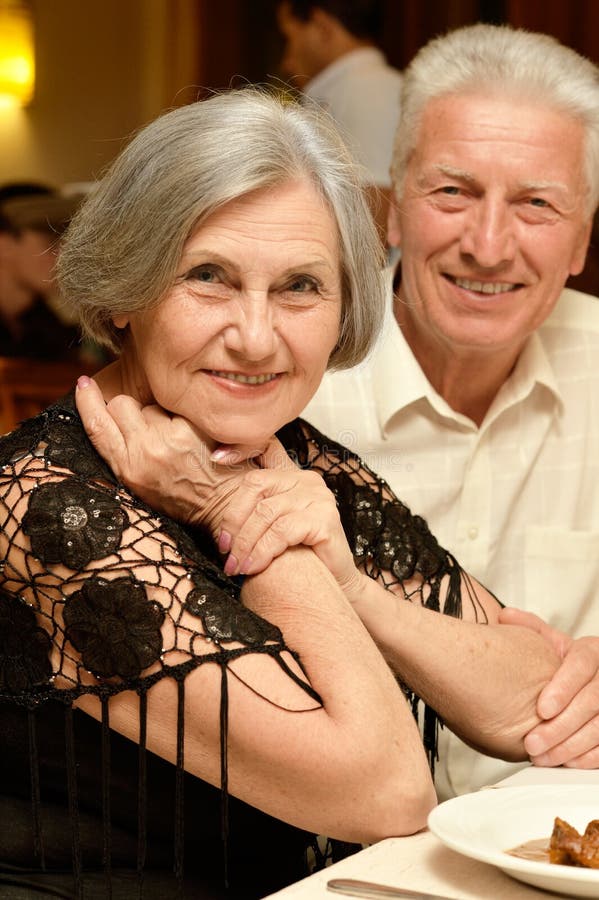 Couple having a dinner stock photo. Image of older, aged - 41617392