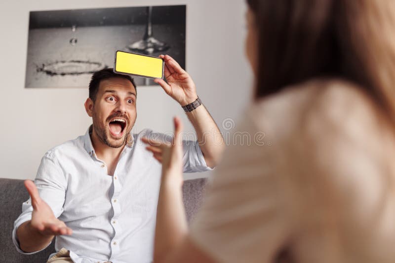 Couple Having Fun Playing Word Guessing Game at Home Stock Photo ...