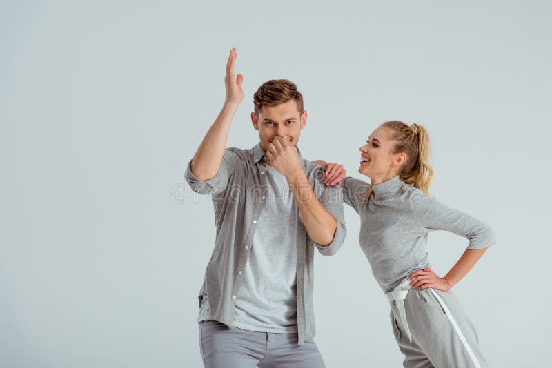 Couple Having Fun and Man Doing Swim Dance Move Isolated Stock Photo ...
