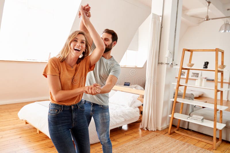 Couple Having Fun in New Home Dancing Together Stock Photo - Image of ...