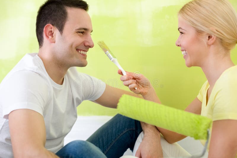 Couple Having Fun while Painting a Room Stock Image - Image of design ...