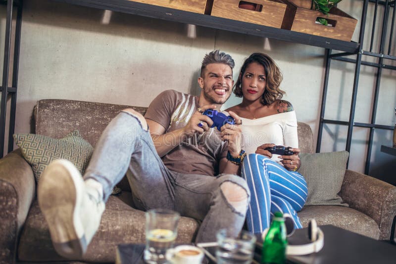 Couple Having Fun while Playing Video Games. Stock Photo - Image of ...