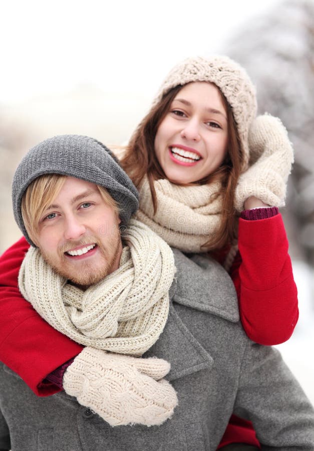 Couple Playing with Snow and Girlfriend Throwing a Ball Stock Photo ...