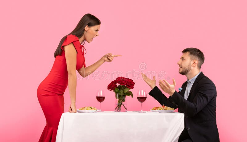 Couple Having Quarrel during Romantic Date on Yellow Studio Background ...