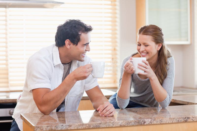 Couple Having Some Coffee in the Kitchen Stock Image - Image of latte ...