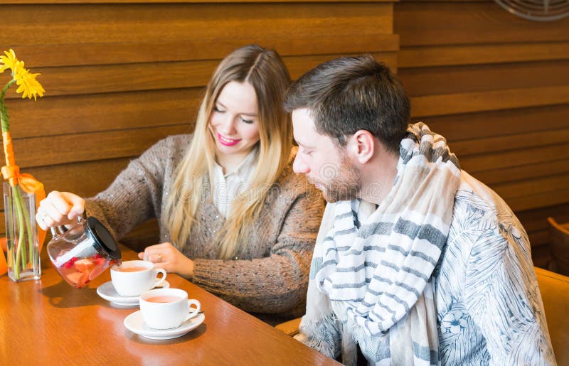 Couple having tea together stock image. Image of connection - 74230297