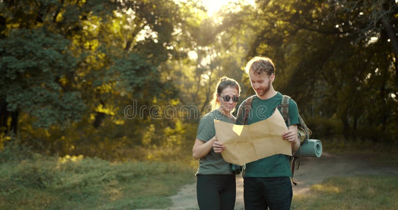 Couple Hikers Look At Map In The Forest Stock Footage Video Of
