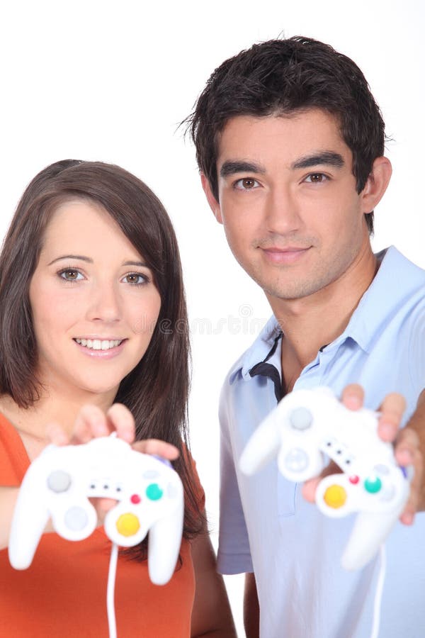 Couple Holding Control Pads Stock Photo - Image of portrait, wires ...