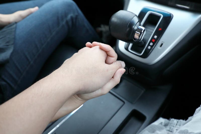 Couple Holding Hand in a Car Stock Image - Image of adult, girl: 95325321