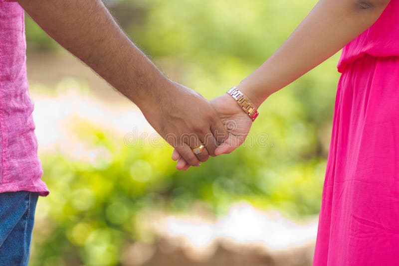 Couple holding hands stock image. Image of hand, affection - 95104645