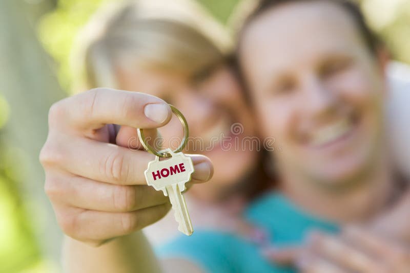 Couple Holding House Key with Home Text Stock Photo - Image of couple ...