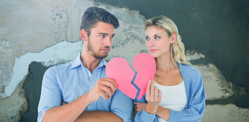 Composite Image of Couple Holding Two Halves of Broken Heart Stock ...