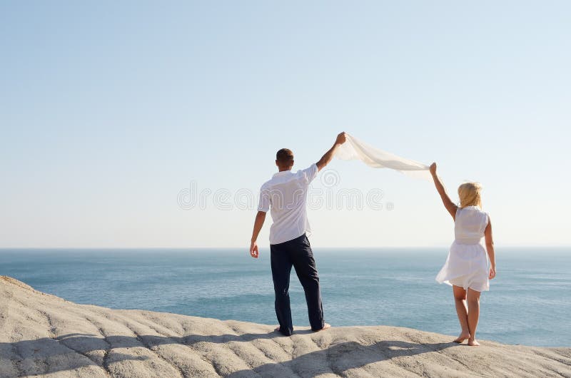 Couple Holding a White Handkerchief Stock Photo - Image of embracing ...