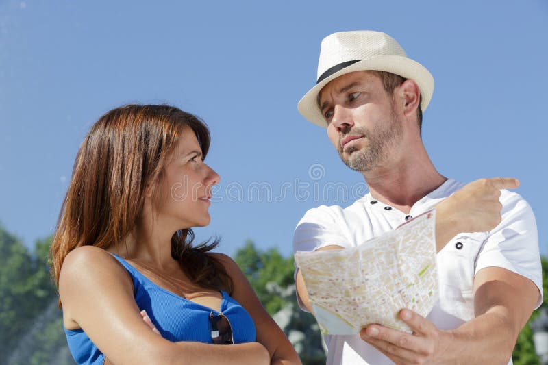 Couple on Holiday Looking at Map and Diagreeing Over Route Stock Image ...