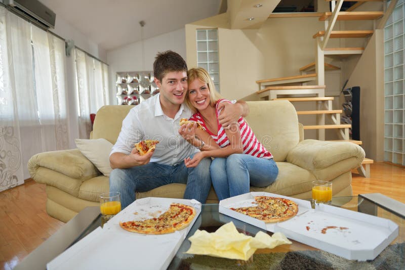 Couple Enjoying Pizza in Front of TV Stock Image - Image of domestic ...