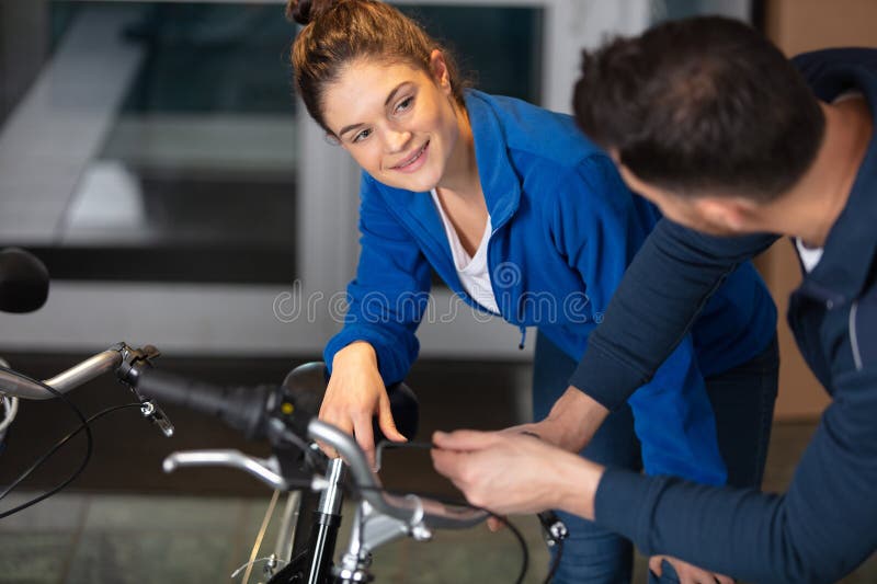 Couple in Home Garage about To Go on Bicycle Ride Stock Photo - Image ...