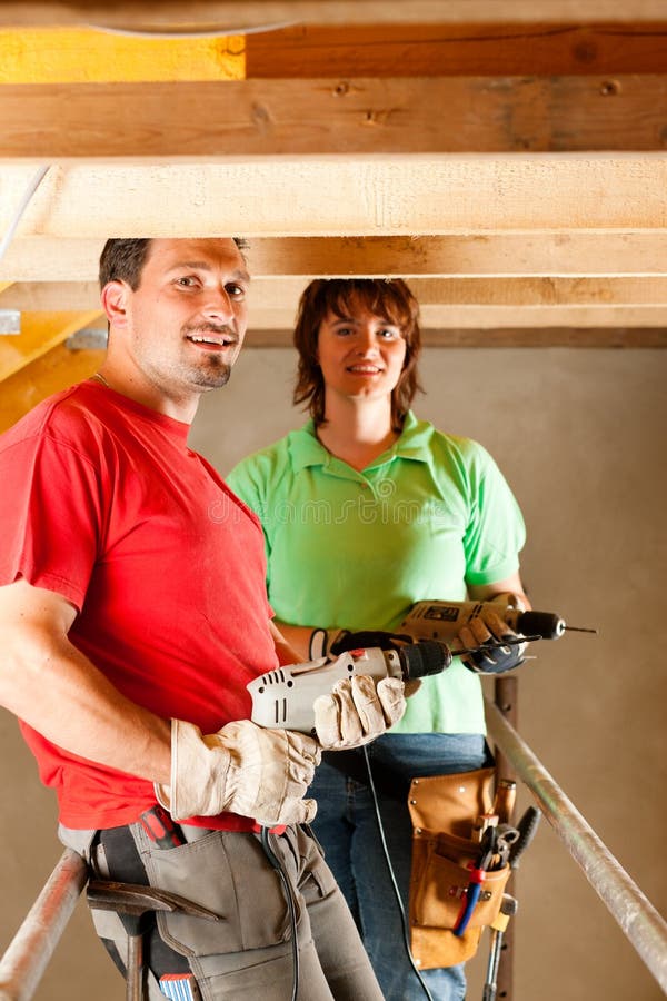 Home Improvement Smiling Couple with Spirit Level Stock Photo - Image ...