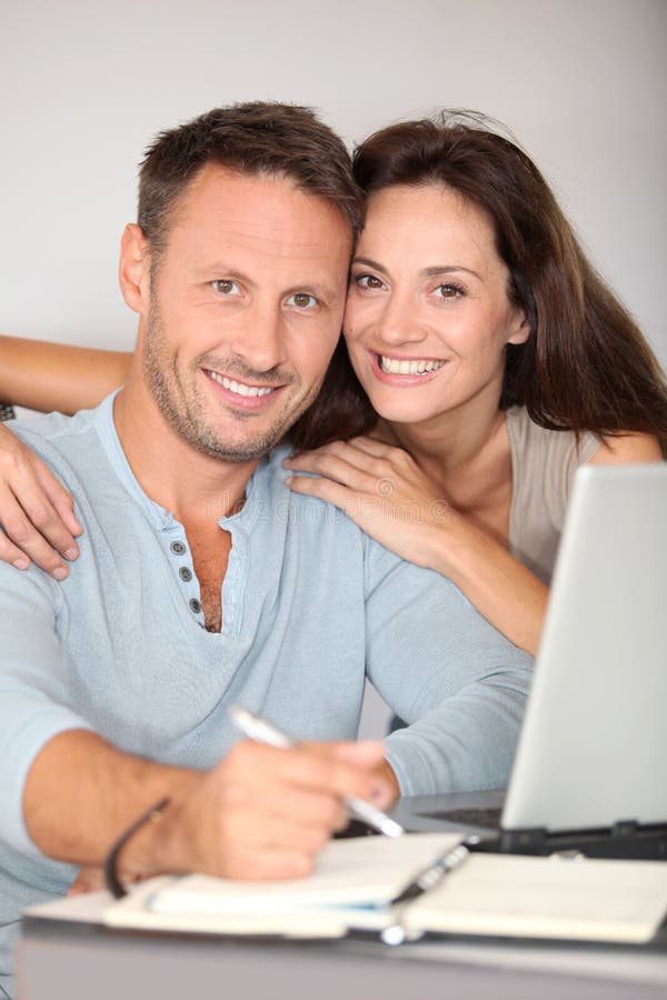 Couple at Home with Laptop Computer Stock Photo - Image of caucasian ...