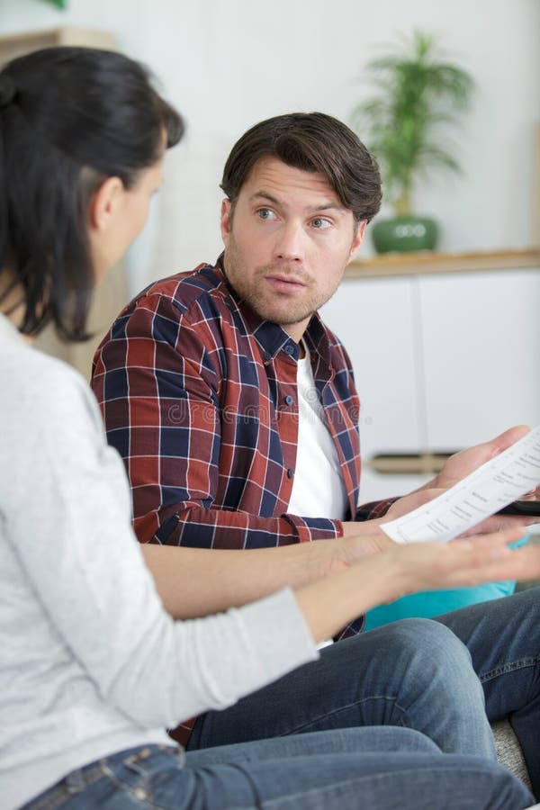 Couple at Home Questioning Document Stock Image - Image of house ...