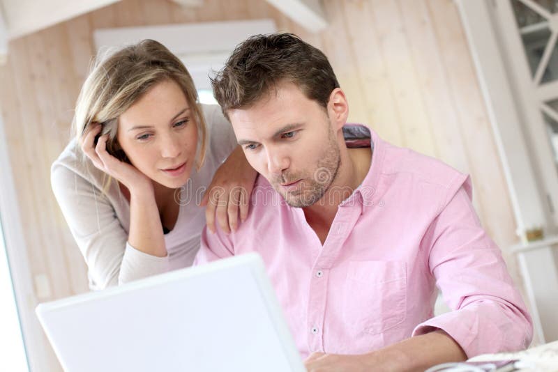 Couple at Home Using Laptop Stock Image - Image of connected, shopping ...