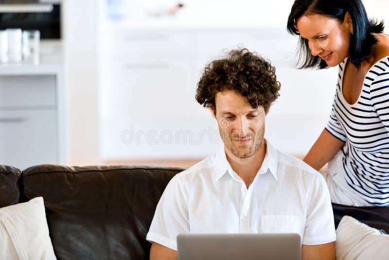 Couple at Home Using Laptop Stock Photo - Image of couch, female: 105753894