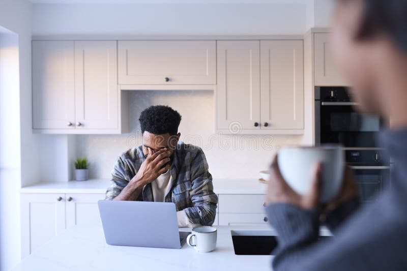Couple at Home Working on Laptop on Counter in Kitchen Stock Image ...