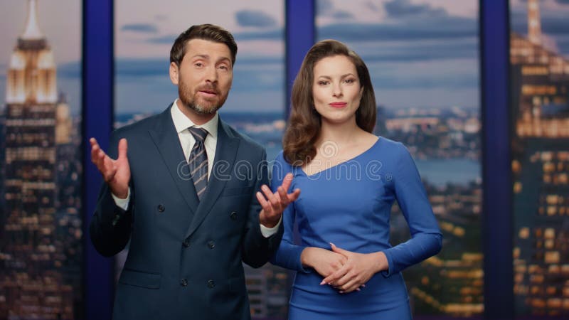 Couple Hosts Reporting Breaking News in Multimedia Channel Studio Close ...