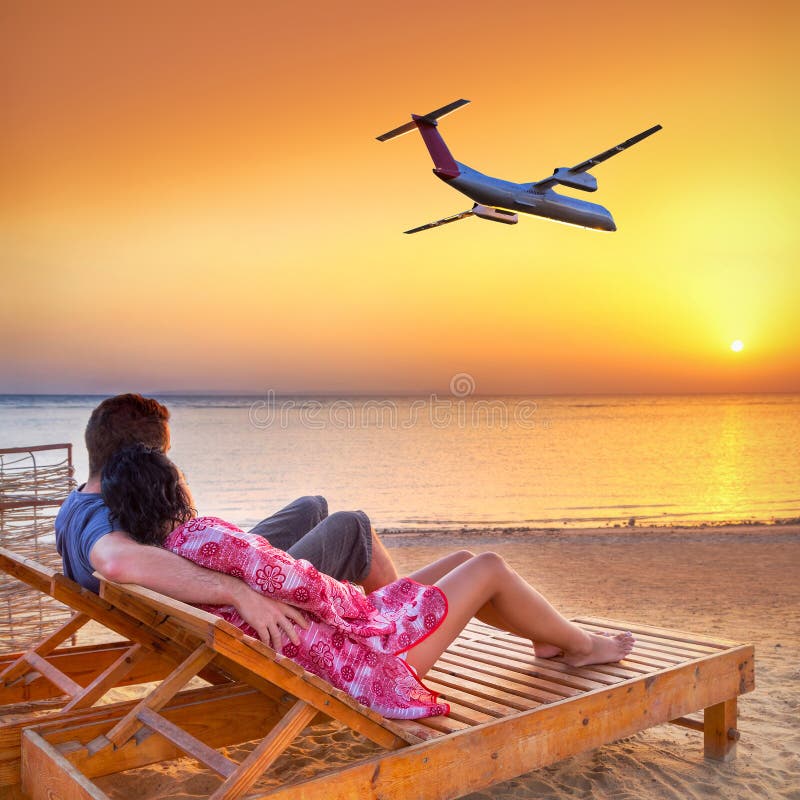 Couple in Hug Watching Airplane at Sunset Stock Photo - Image of ...